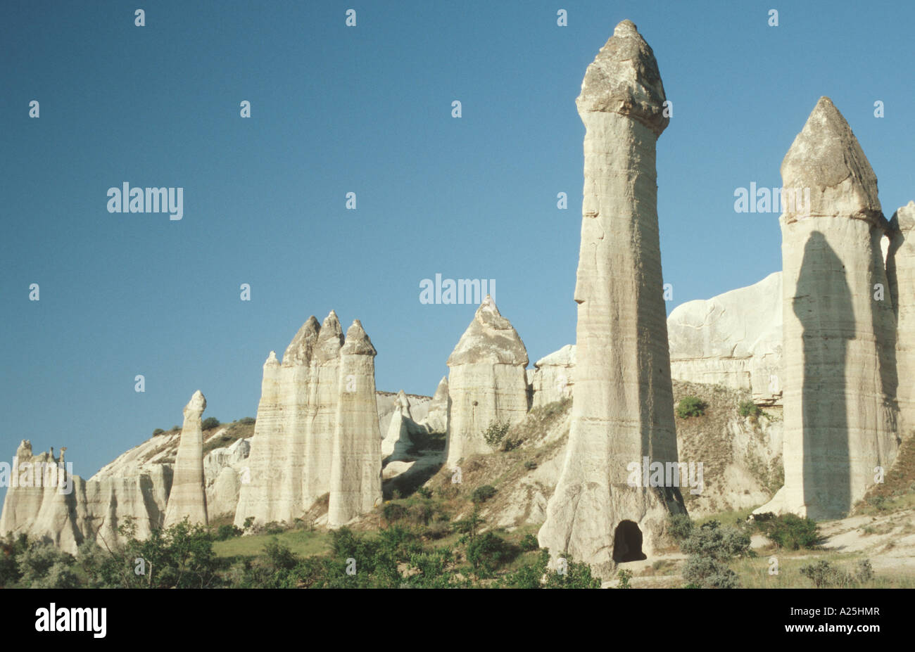 stone columns with an anchoret dwelling cave, Turkey, Kappadokien ...