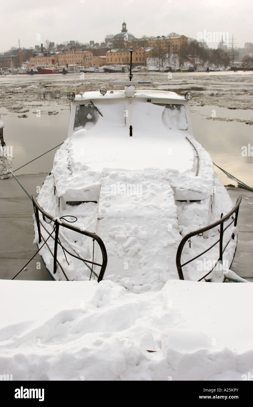 Boat covered in snow Stock Photo - Alamy