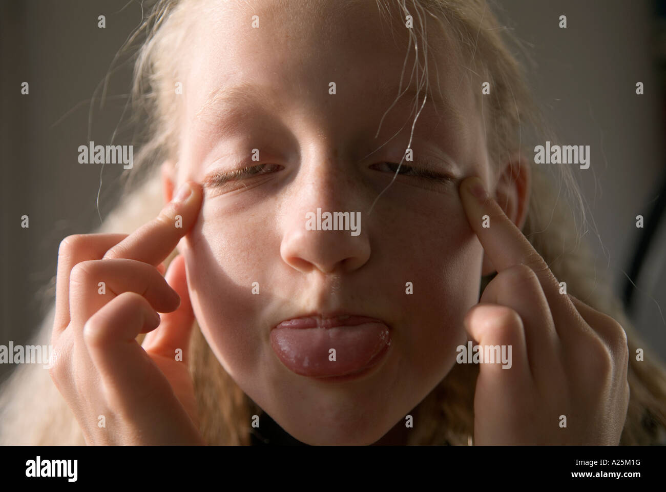 Child making funny faces hi-res stock photography and images - Alamy