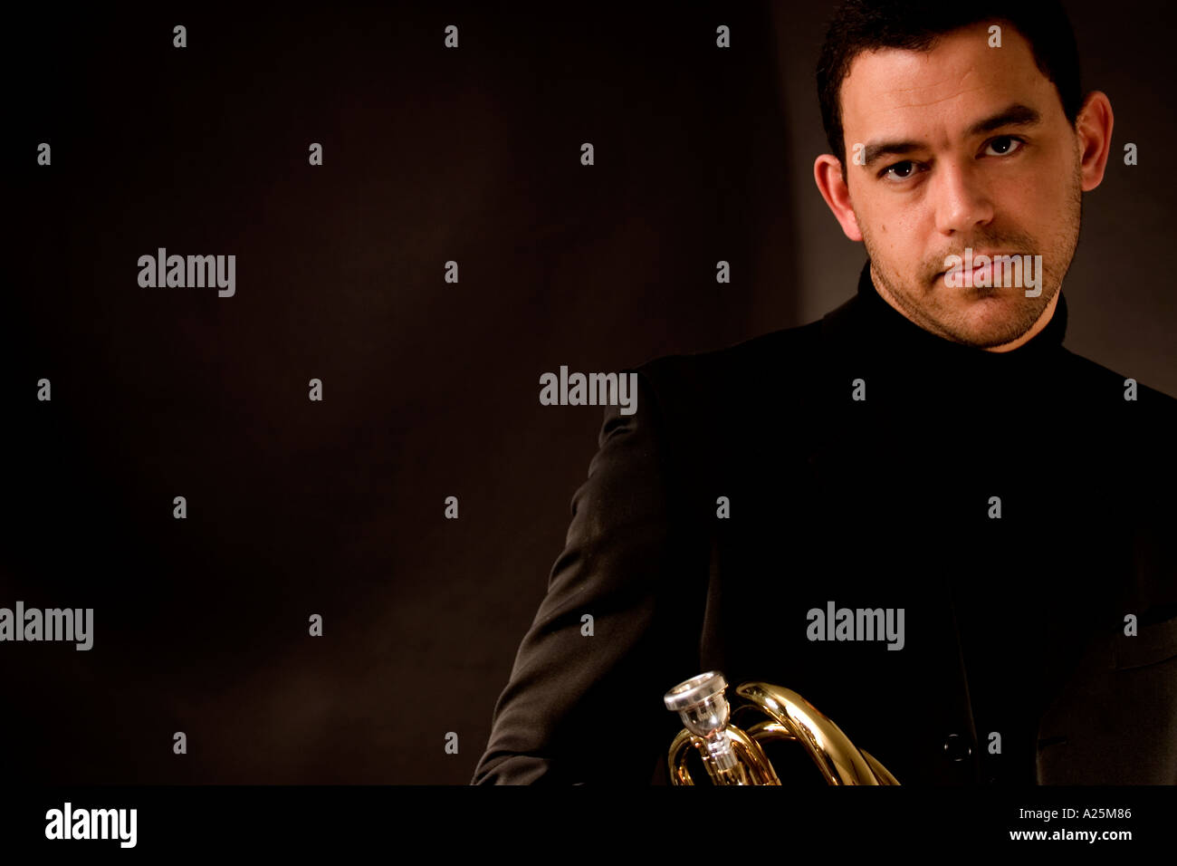 Man men male adult adults playing horn hi-res stock photography and ...