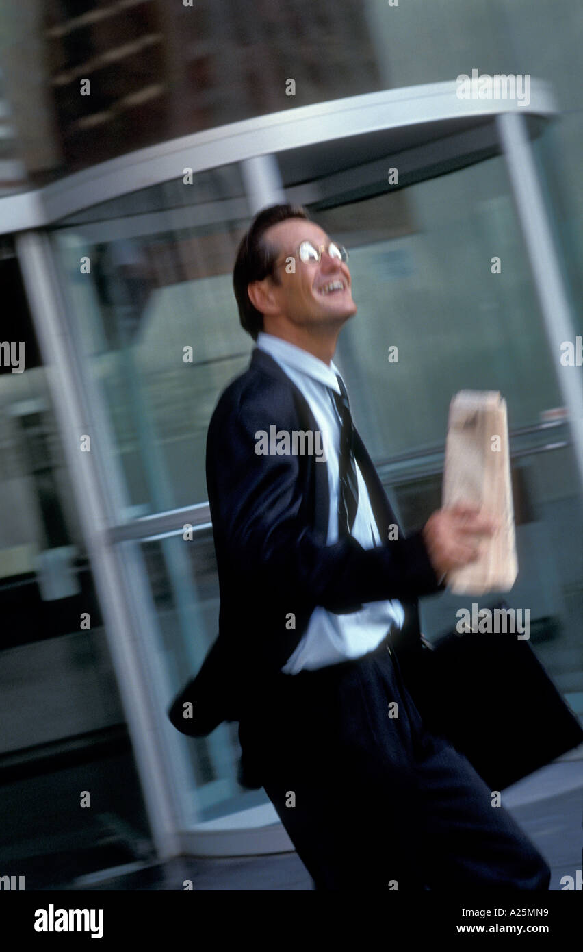 businessman leaving office building Stock Photo - Alamy