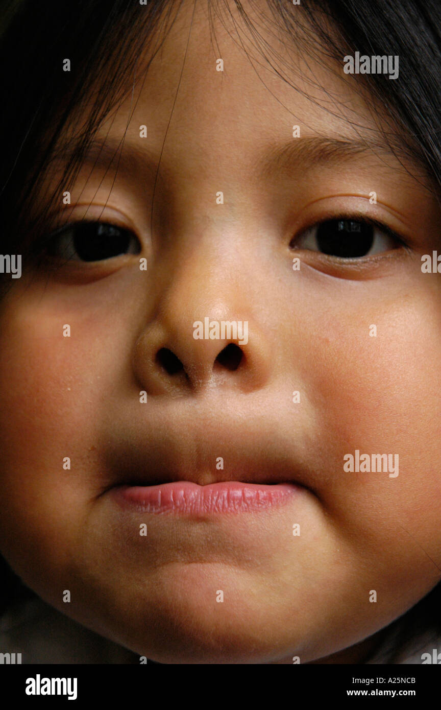 A three year old Mayan baby girl making facial expressions Stock Photo ...
