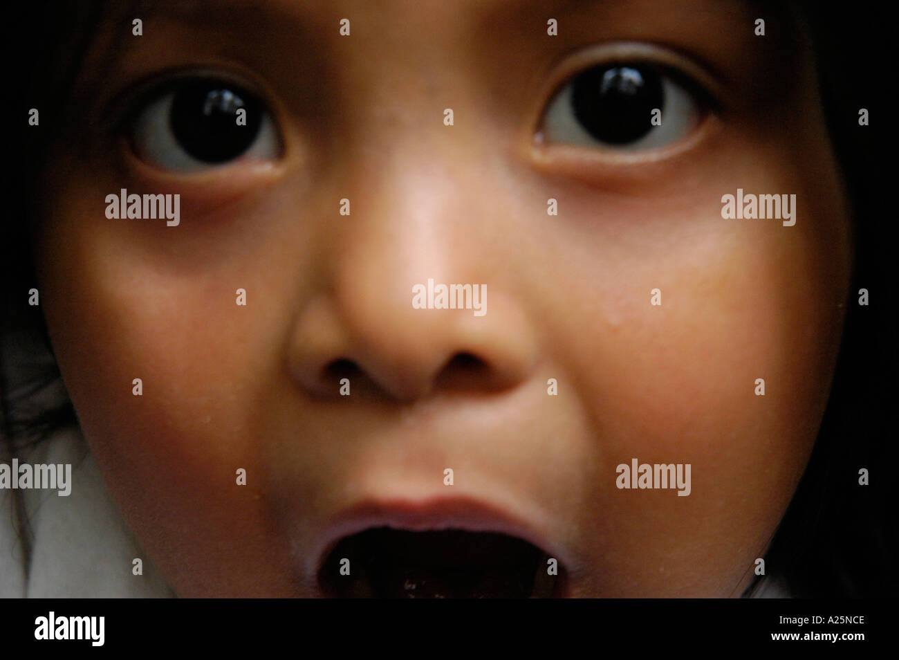 A three year old Mayan baby girl making facial expressions Stock Photo ...
