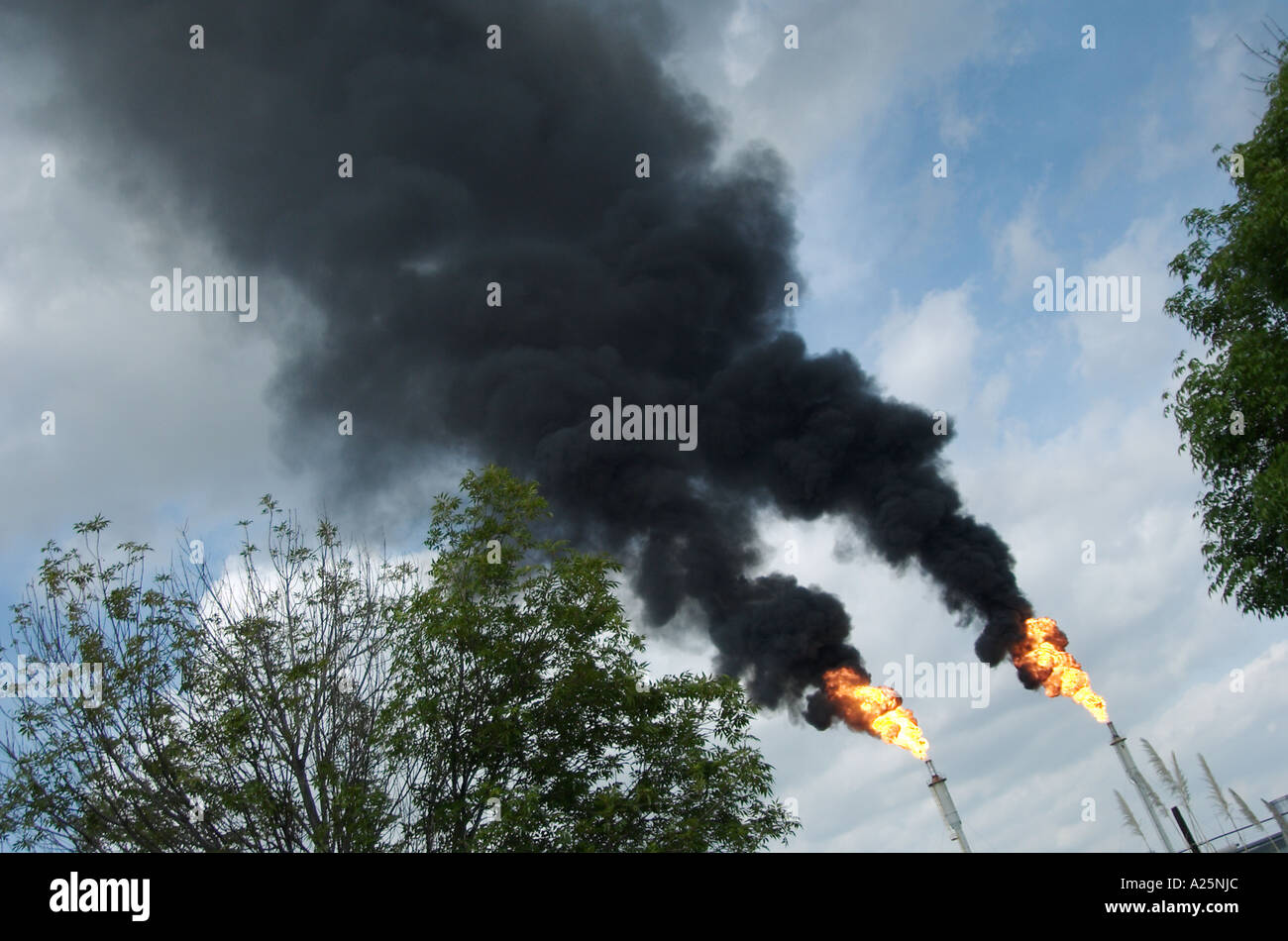 Intense hot fires burning from oil refinery flares Stock Photo - Alamy