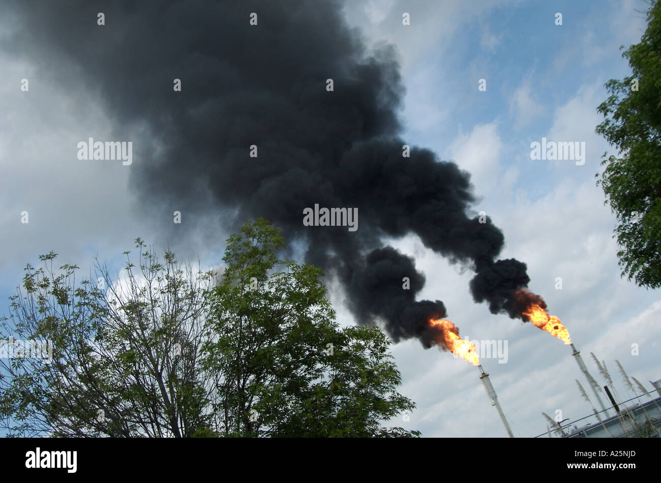 Intense hot fires burning from oil refinery flares Stock Photo - Alamy