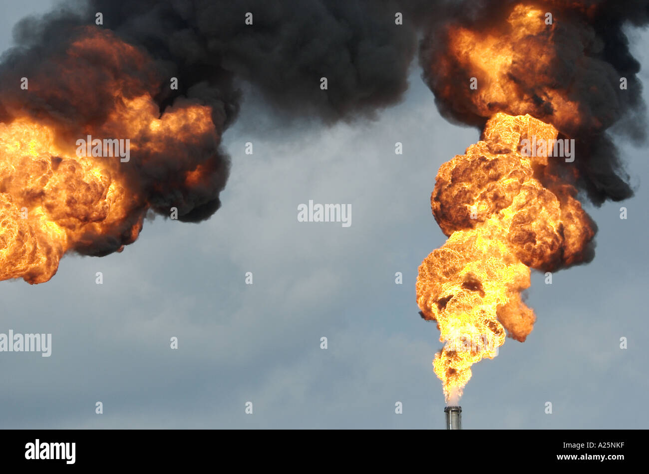 Intense hot fires burning from oil refinery flares Stock Photo - Alamy