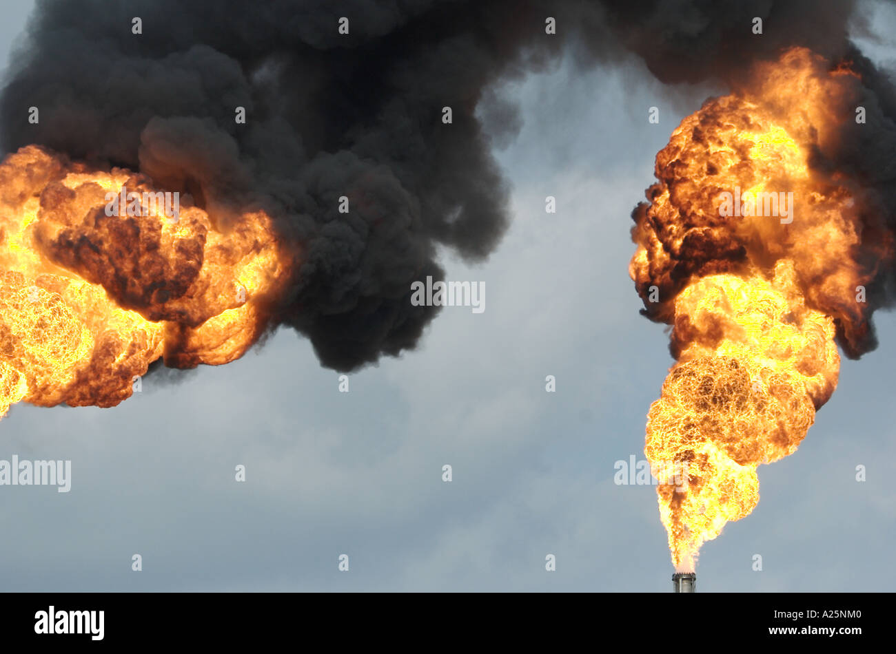 Intense hot fires burning from oil refinery flares Stock Photo - Alamy