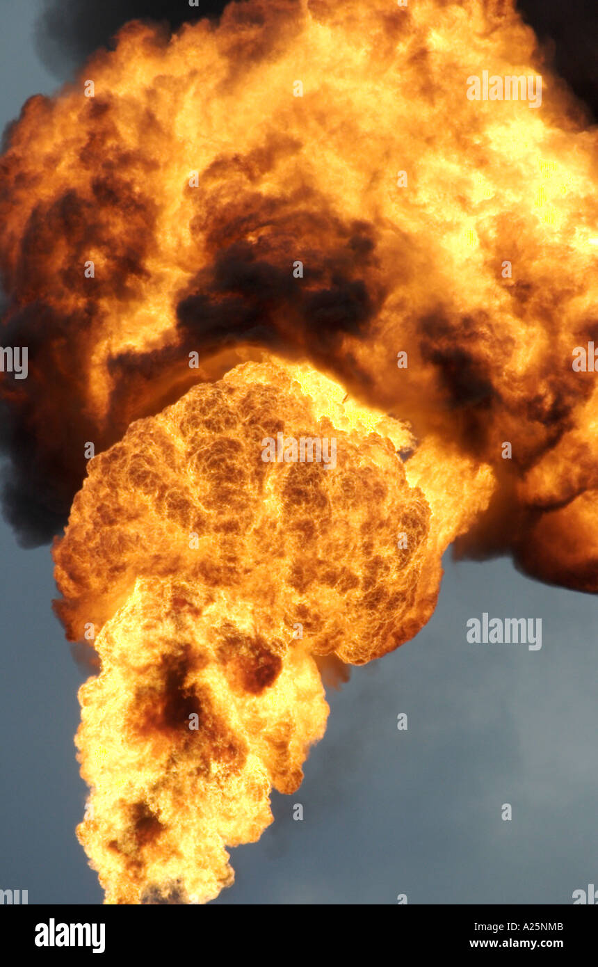 Intense hot fires burning from oil refinery flares Stock Photo - Alamy