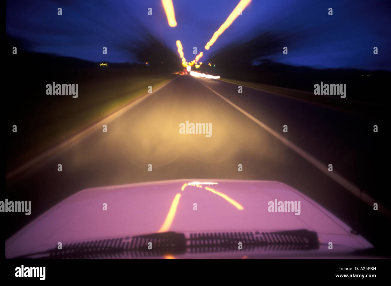 car streaking along road fast racing at night Stock Photo - Alamy