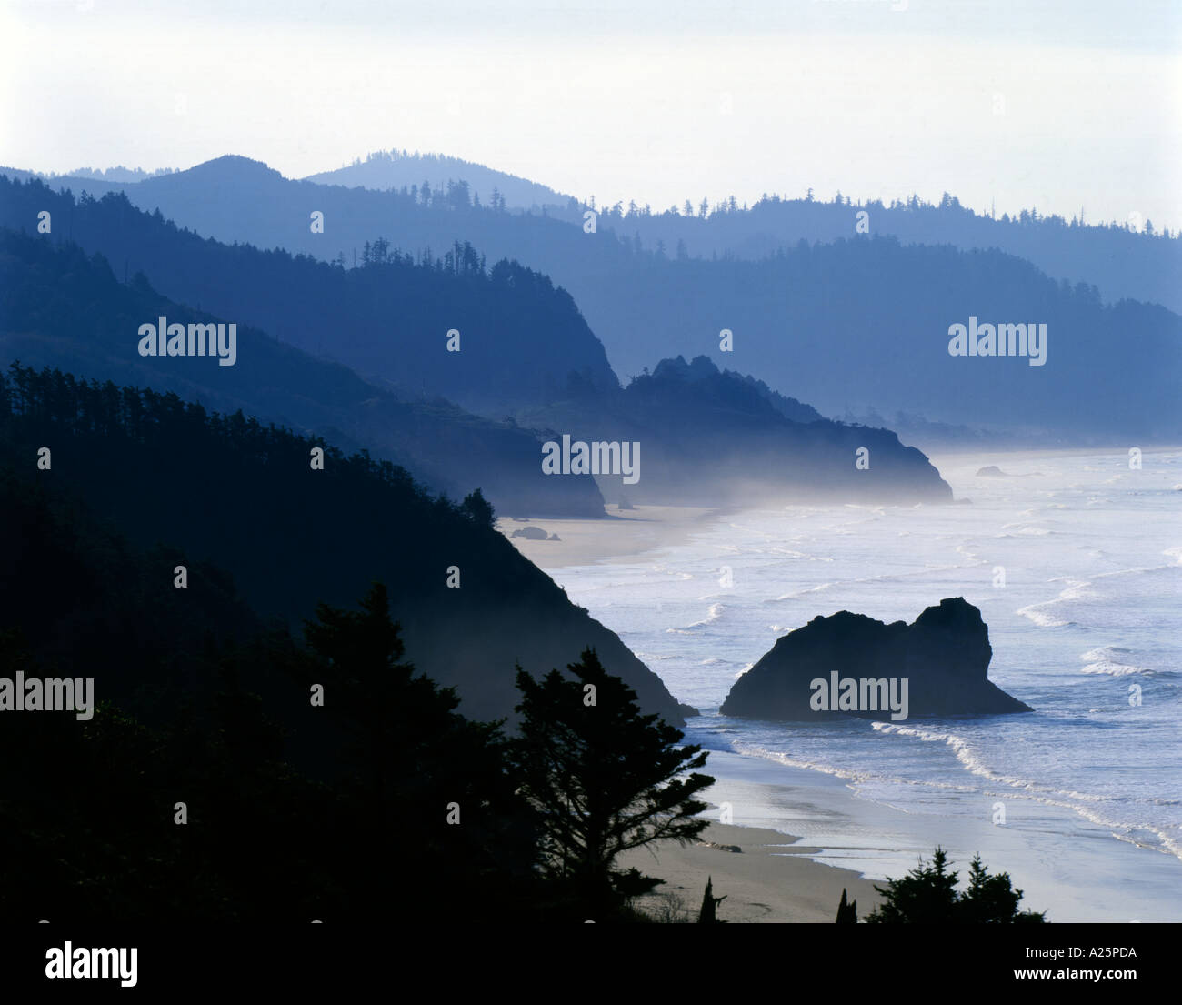 Rugged forested headlands jut into the roaring surf of the Pacific ...