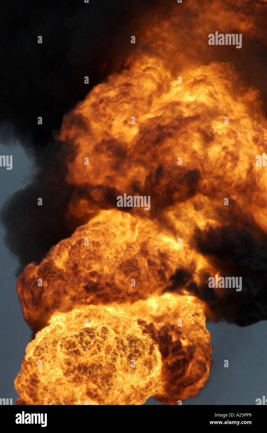 Intense hot fires burning from oil refinery flares Stock Photo - Alamy
