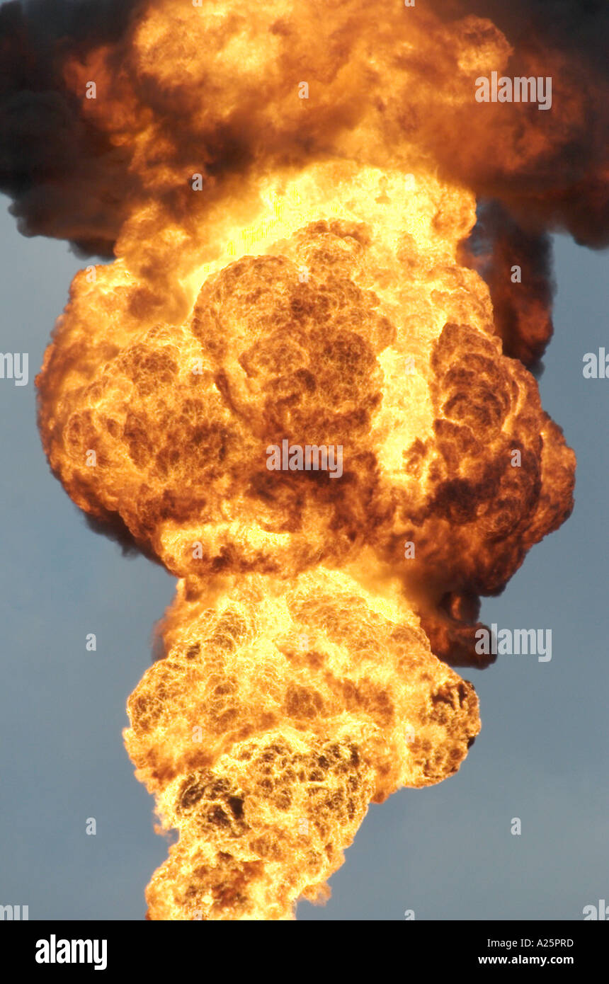 Intense hot fires burning from oil refinery flares Stock Photo - Alamy