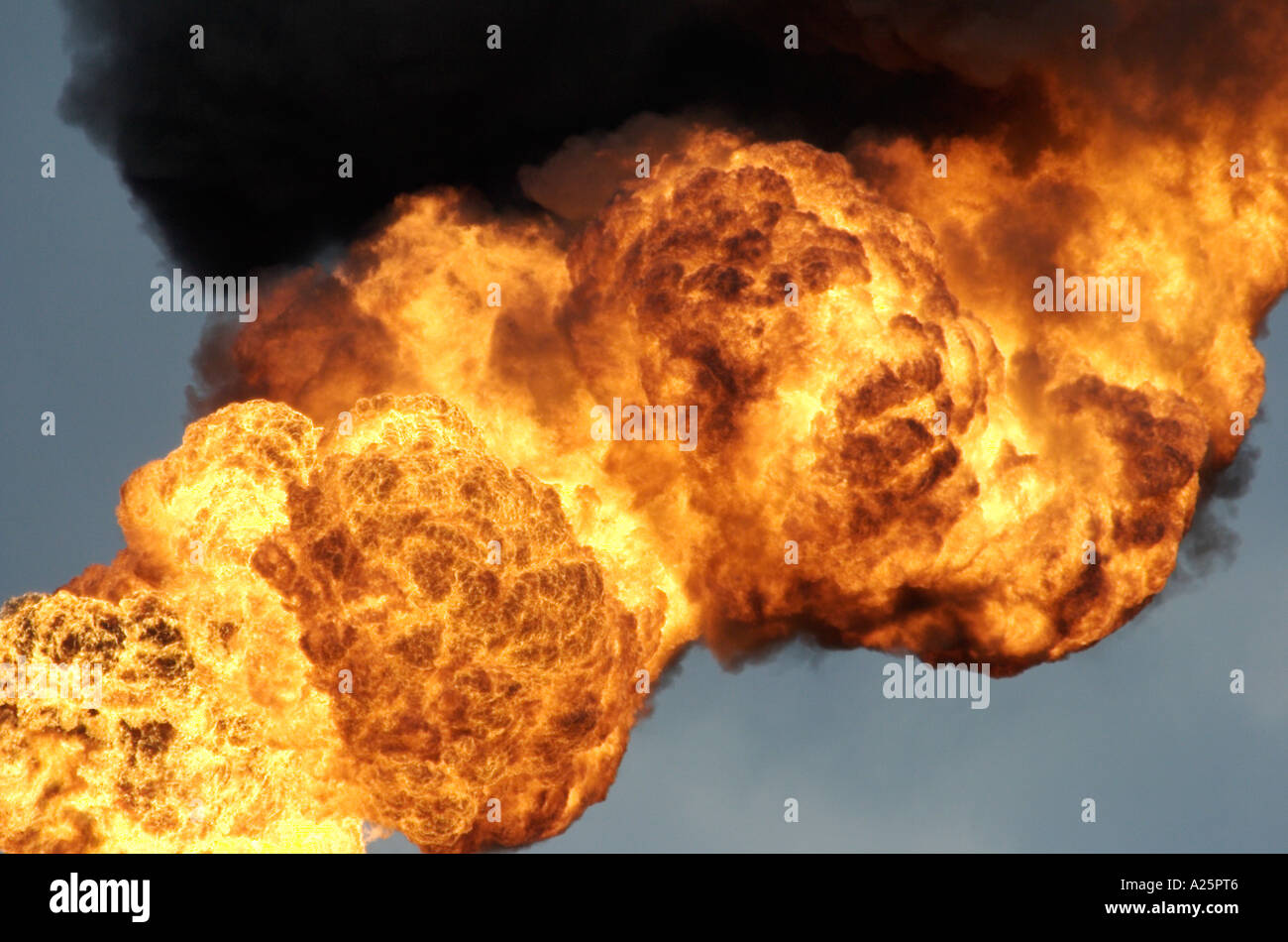Intense hot fires burning from oil refinery flares Stock Photo - Alamy
