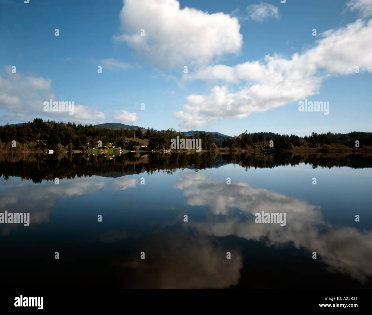 Sutton Lake near Florence in Oregon on a glassy calm morning with ...