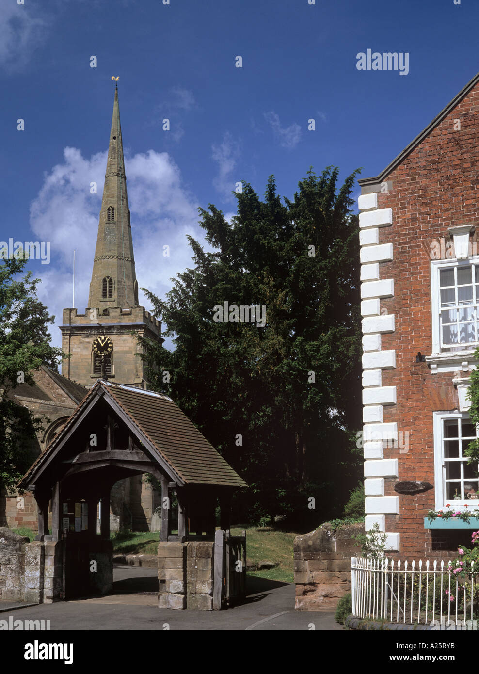 ST CASSIANS CHURCH and Lychgate House in the main village street ...
