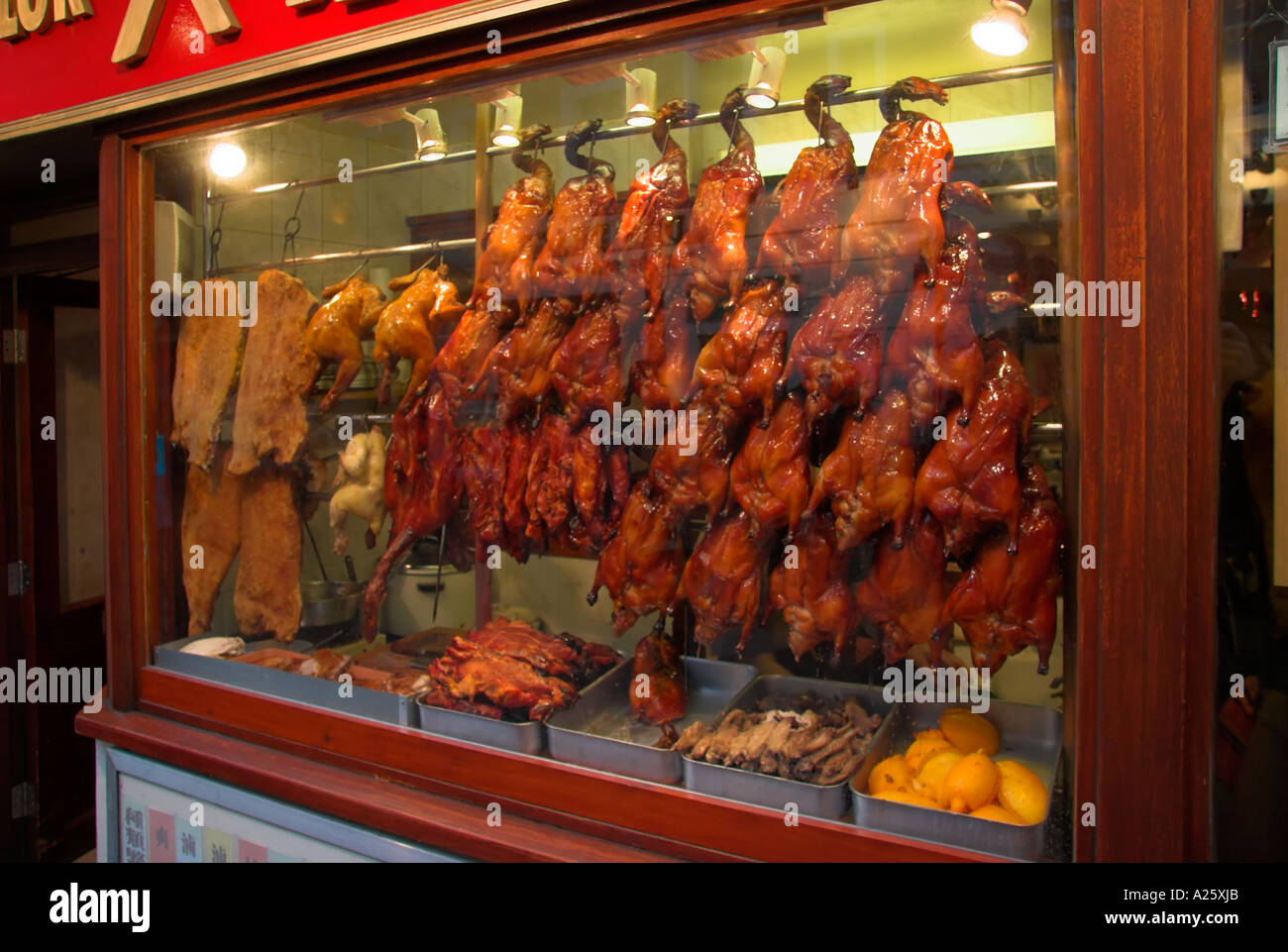 Roast chickens on display in the window of a Chinese restaurant Gerrard ...