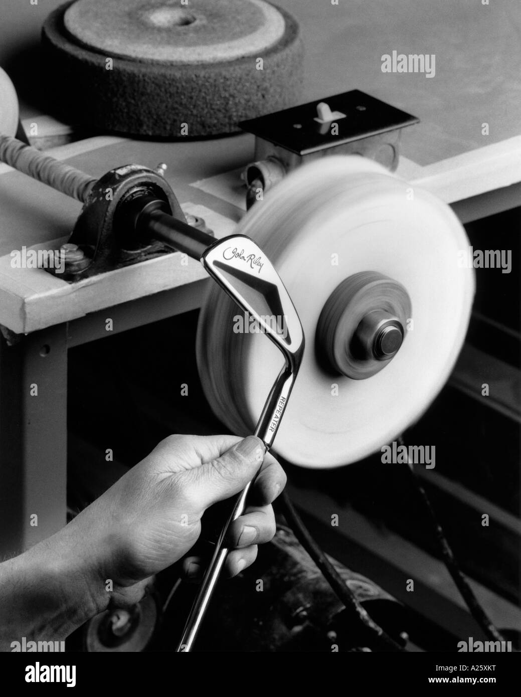 Polishing a putter at a GOLF CLUB FACTORY which makes clubs by hand ...
