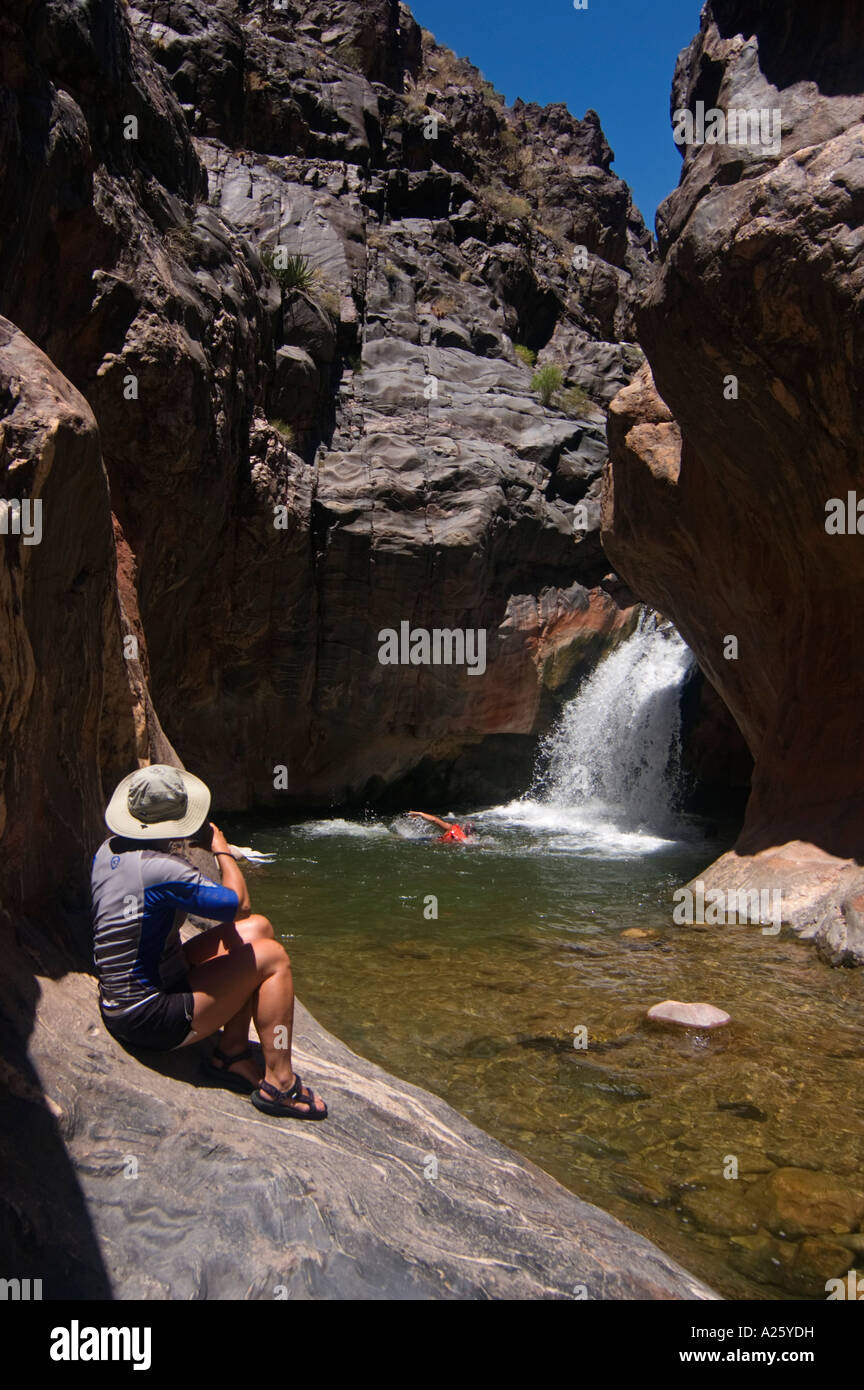 Hikers enjoy the waterfall at SHINOMU CREEK at mile 108 along the ...
