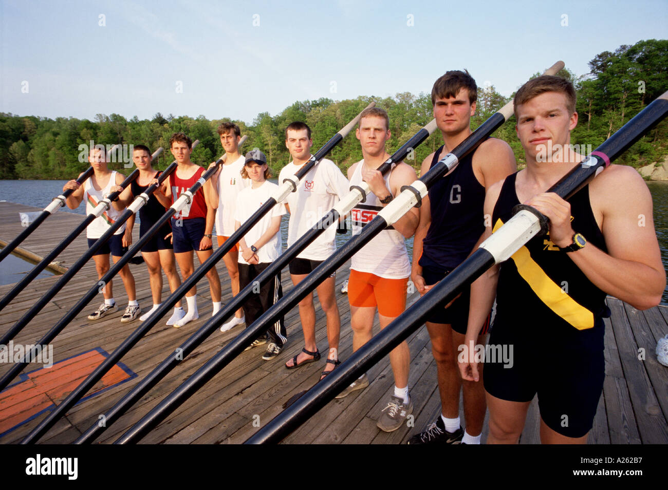 ROWERS HOLDING OARS Stock Photo - Alamy