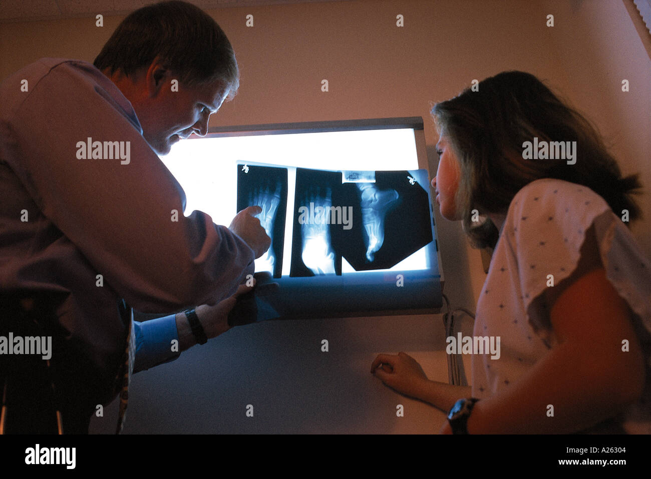 Doctor showing rays patient hi-res stock photography and images - Alamy