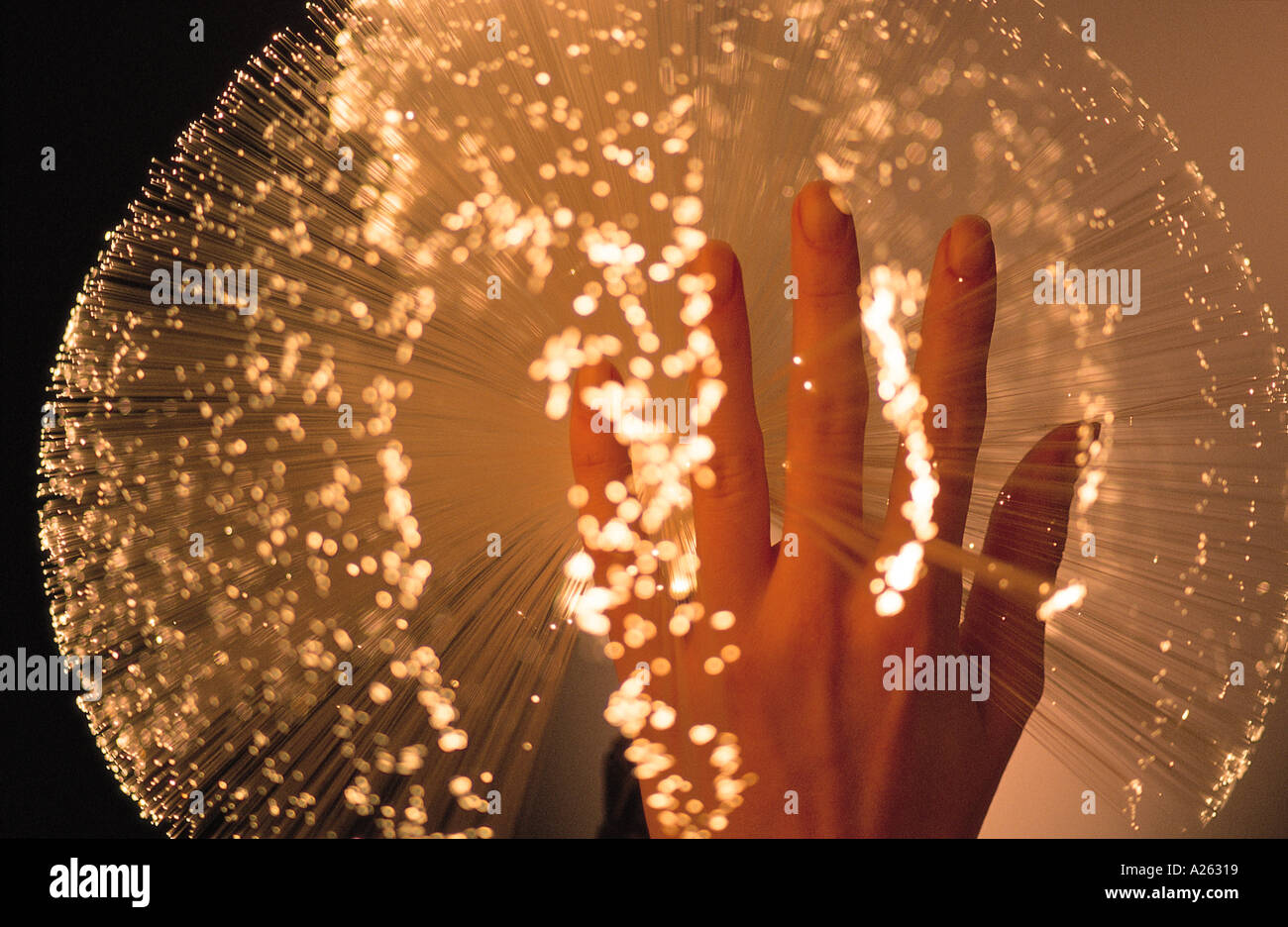 HAND WITH FIBRE OPTICS Stock Photo - Alamy