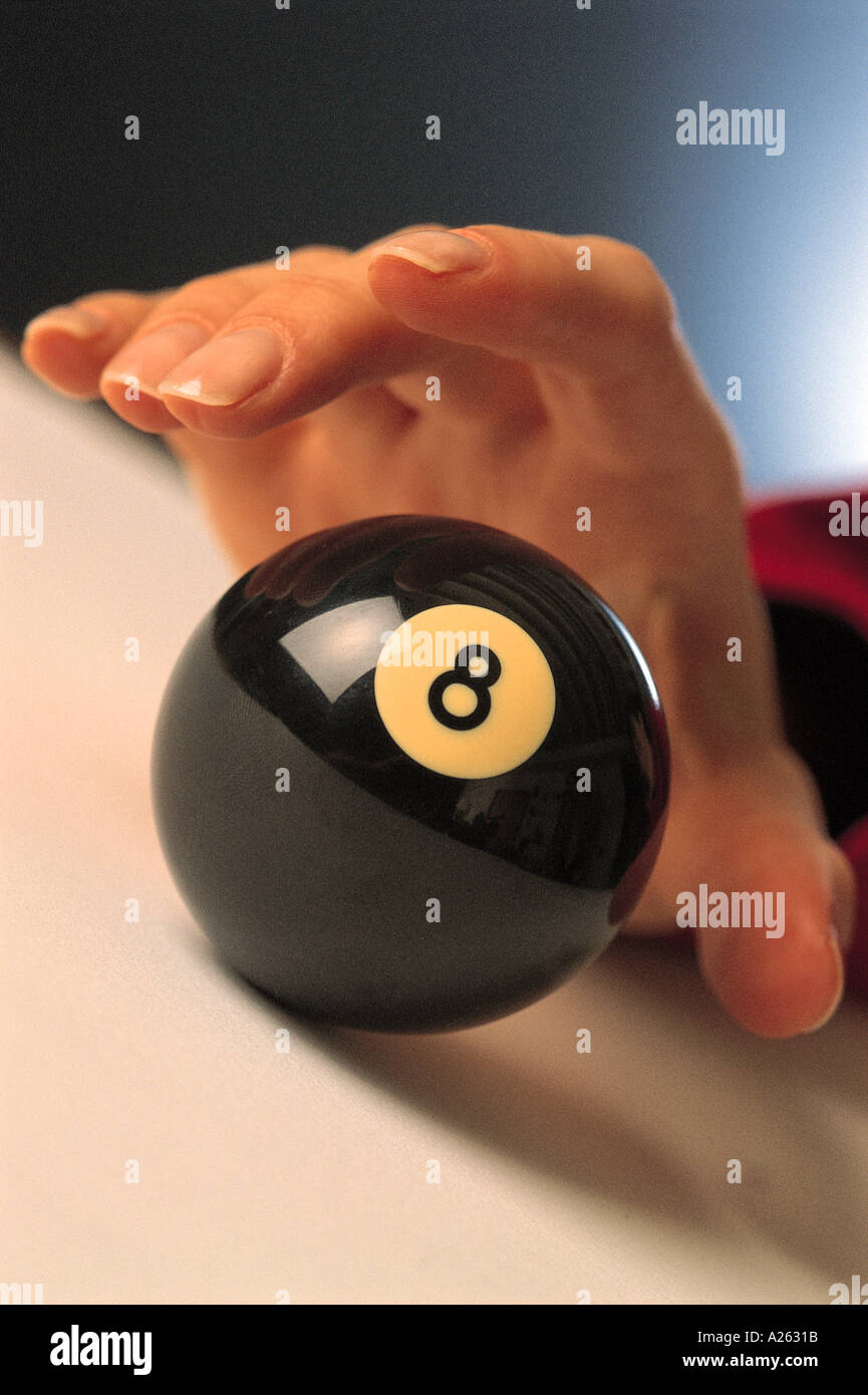 HAND ABOUT TO GRASP BLACK BALL Stock Photo - Alamy