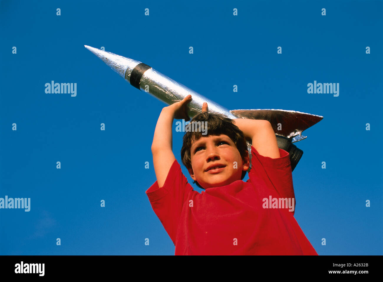 BOY WITH MODEL SPACE ROCKET Stock Photo - Alamy