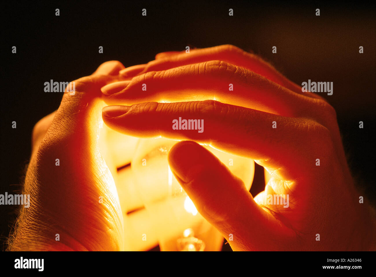 Hands in light hi-res stock photography and images - Alamy
