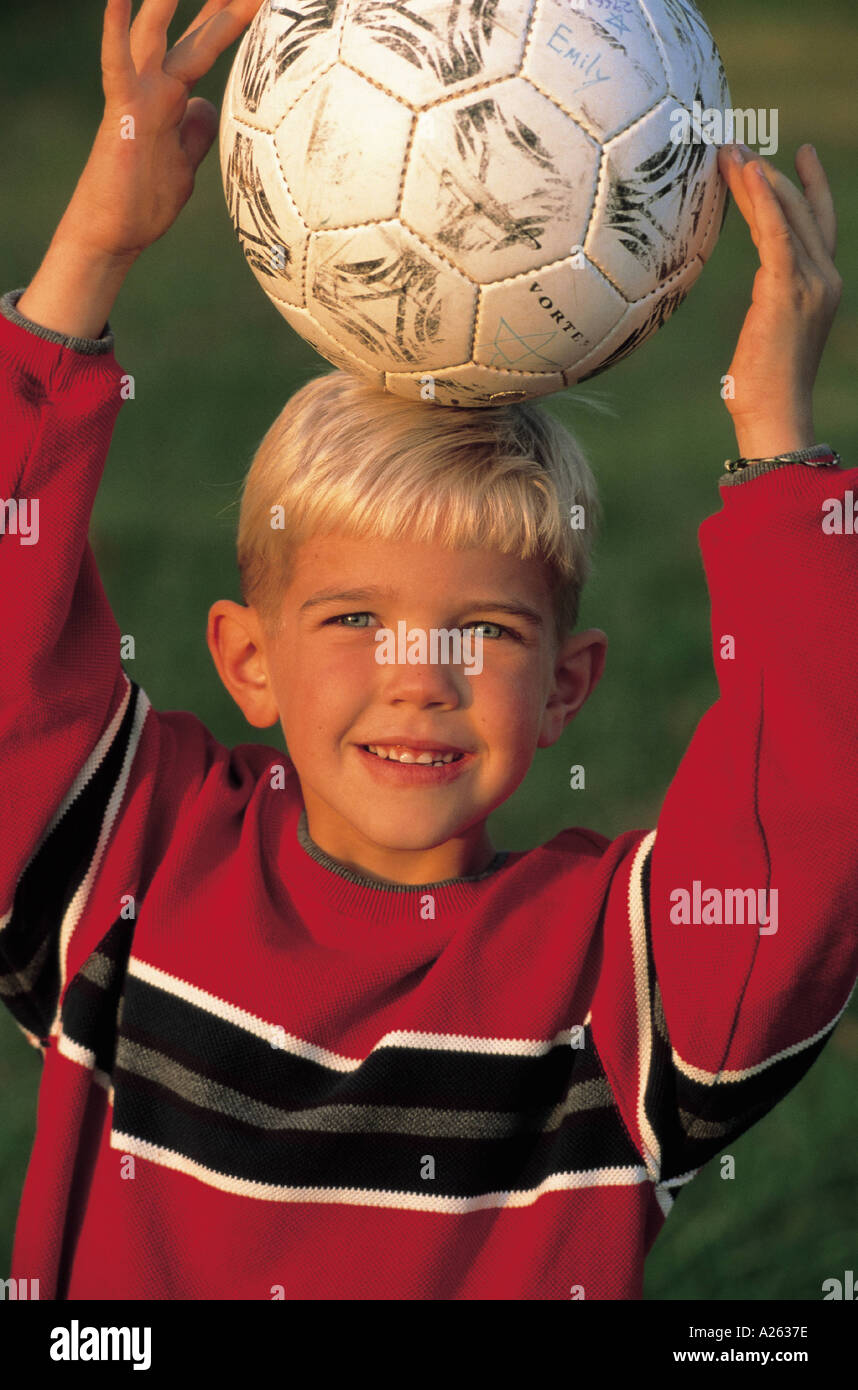BOY WITH FOOTBALL Stock Photo - Alamy
