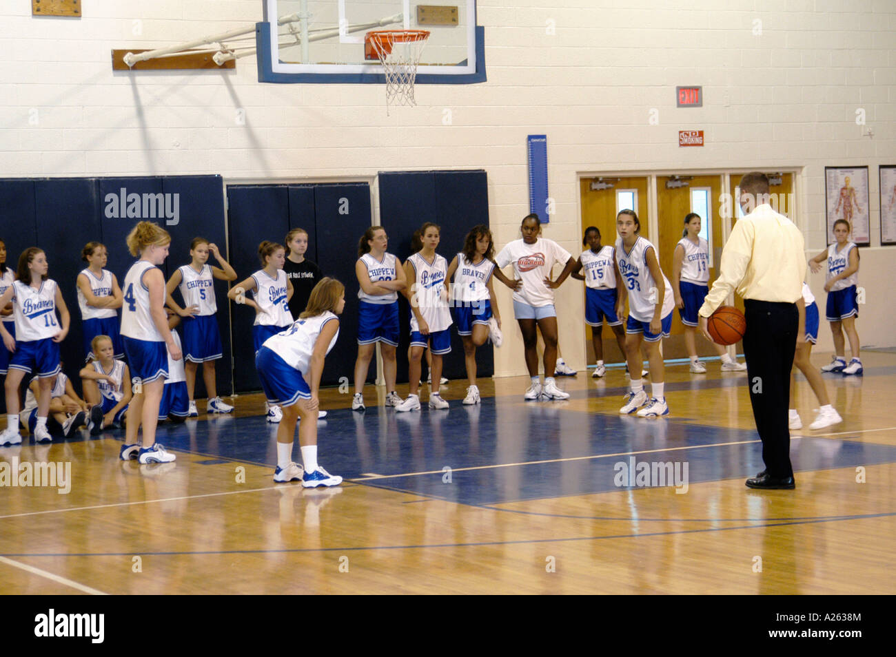 Middle school age girls prepare to play basketball Stock Photo - Alamy