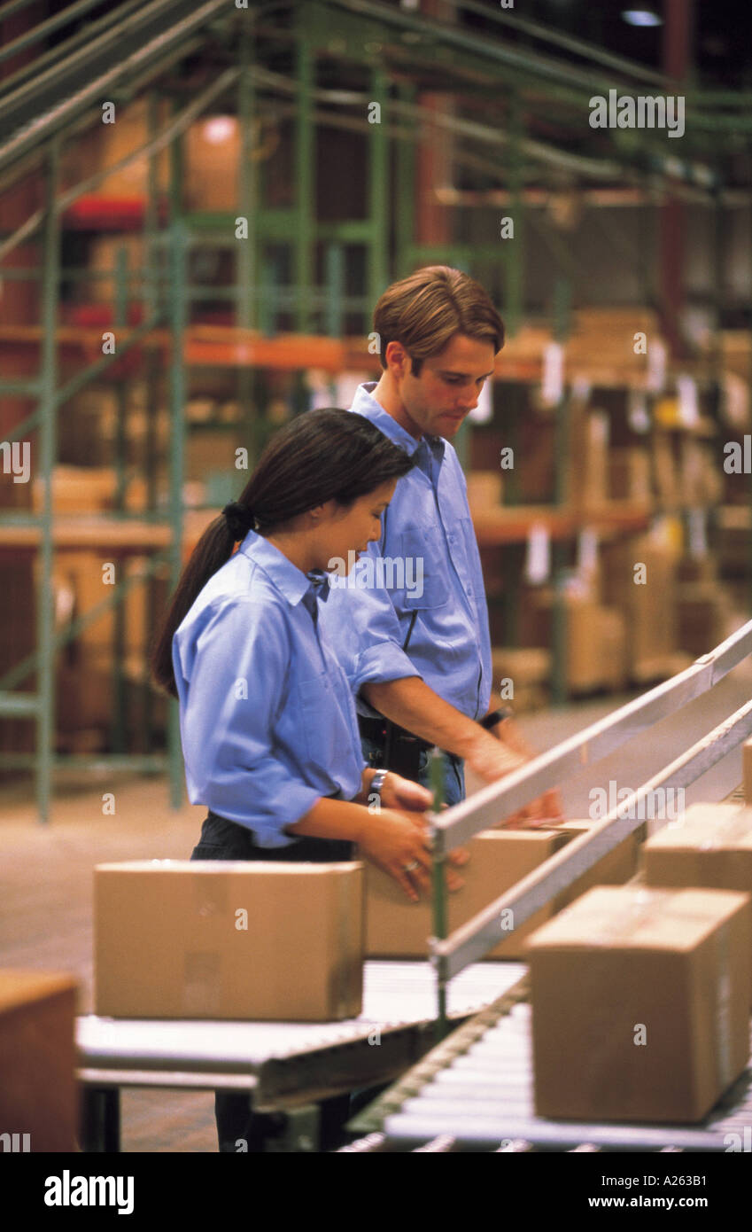 Female warehouse working pushing boxes hi-res stock photography and ...