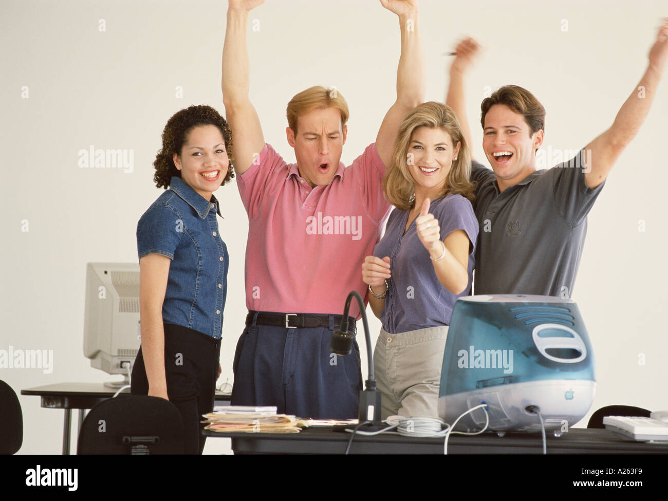 PEOPLE CELEBRATING IN OFFICE Stock Photo - Alamy