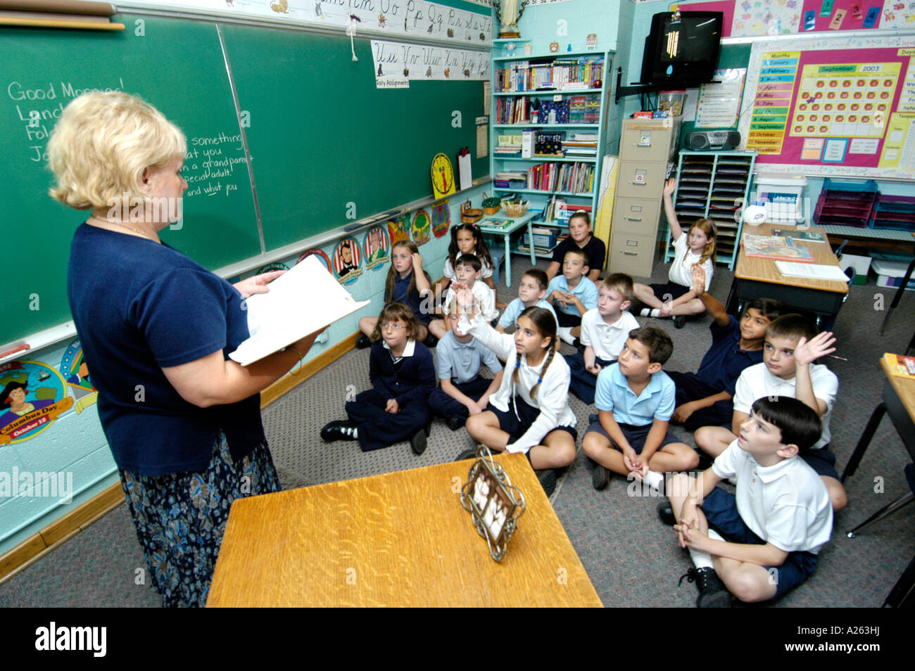 Group of students sit on floor Stock Photo - Alamy