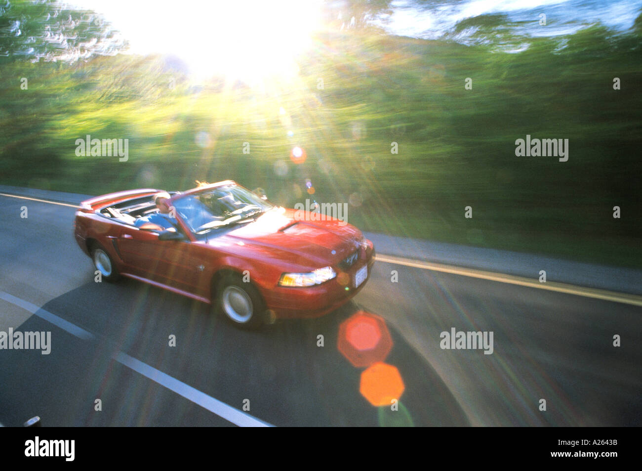 Adult couple driving red sports car hi-res stock photography and images ...