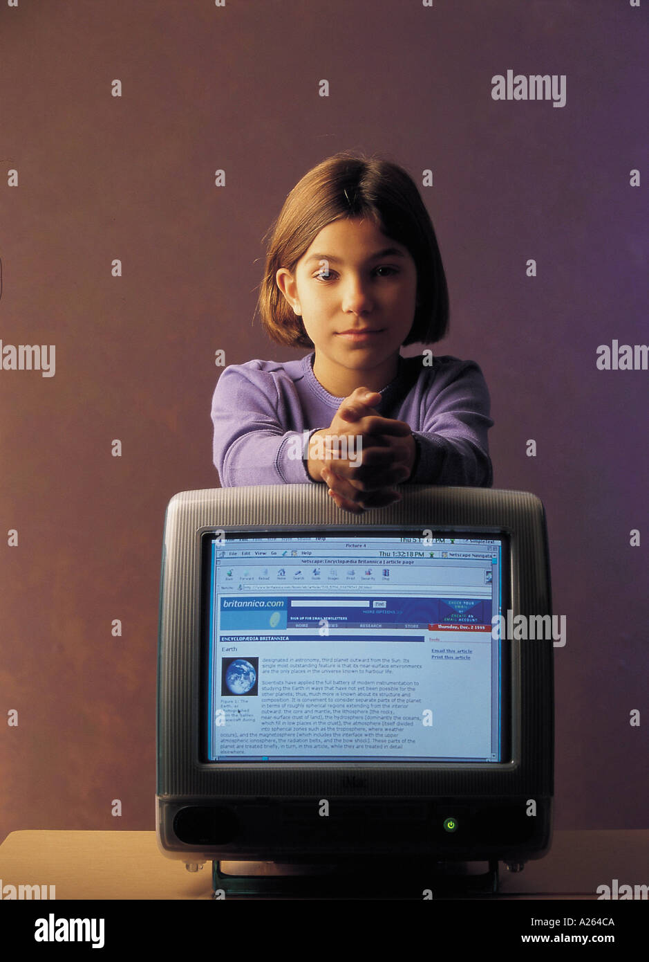 CHILD POSING BEHIND COMPUTER SCREEN Stock Photo - Alamy
