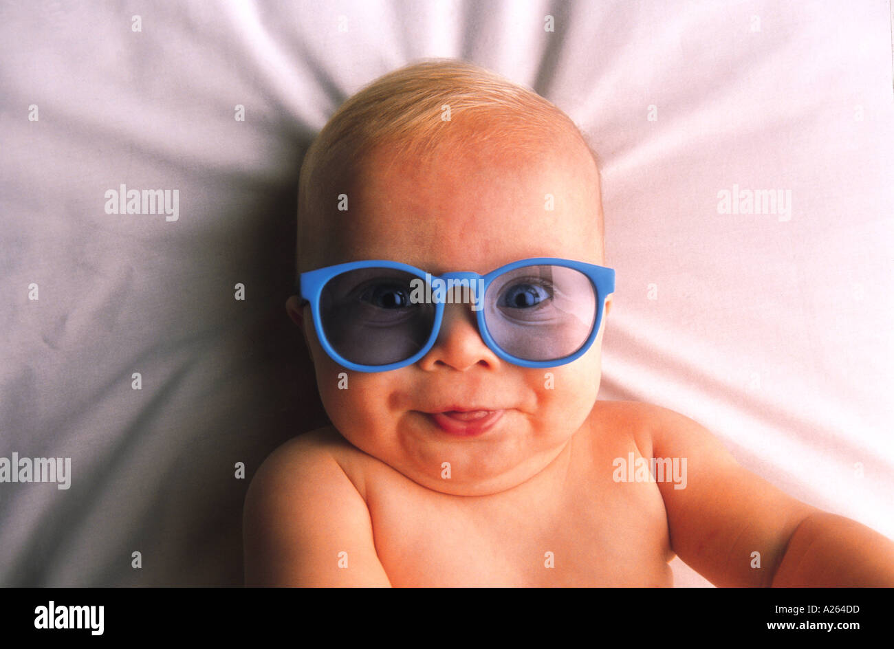 BABY IN SUN GLASSES GURGLING Stock Photo - Alamy