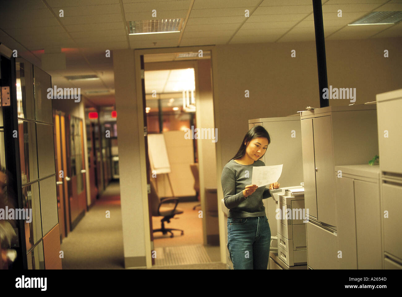 WOMAN READING PAPER Stock Photo - Alamy