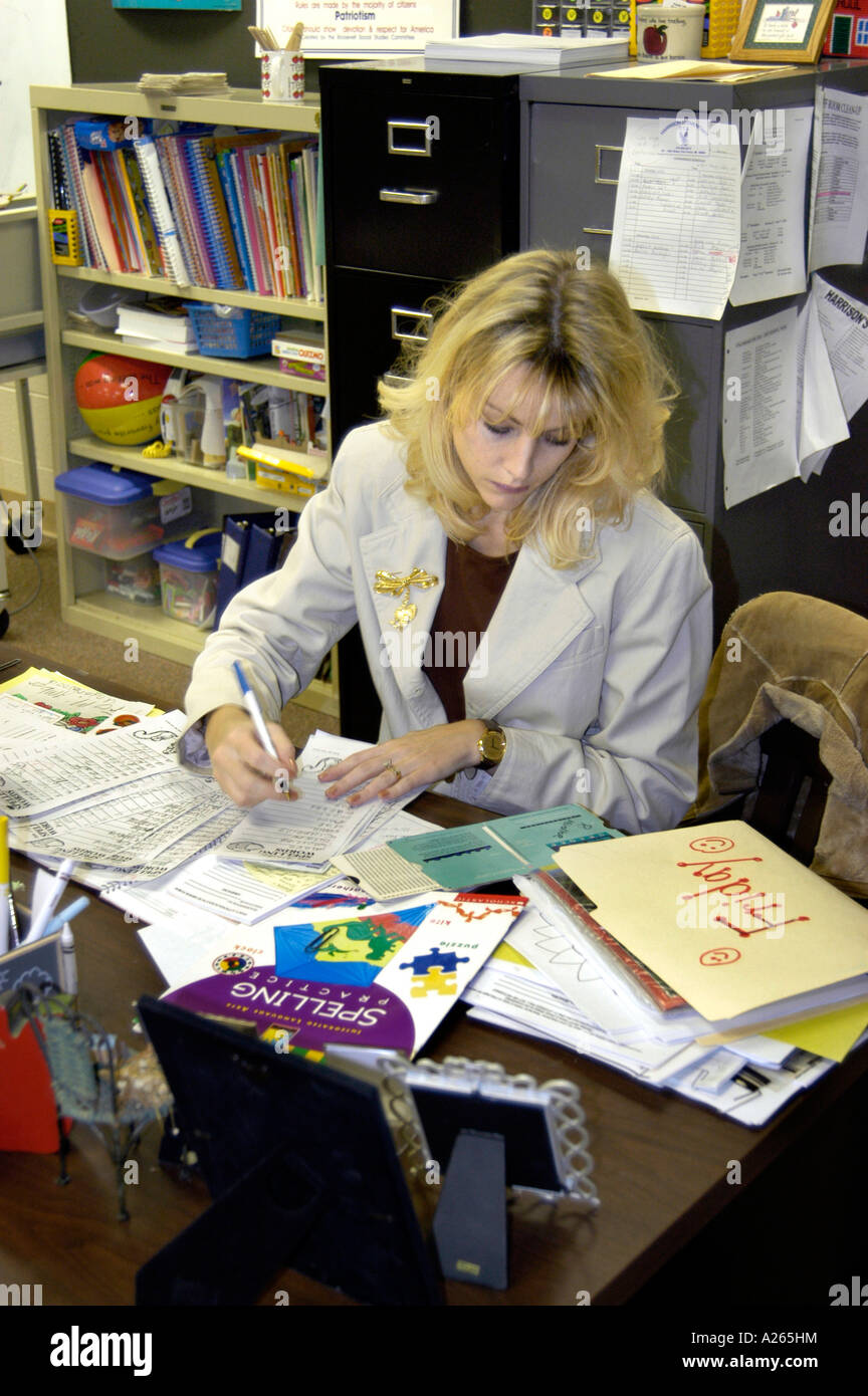 3rd grade elementary class with teacher working alone Stock Photo - Alamy