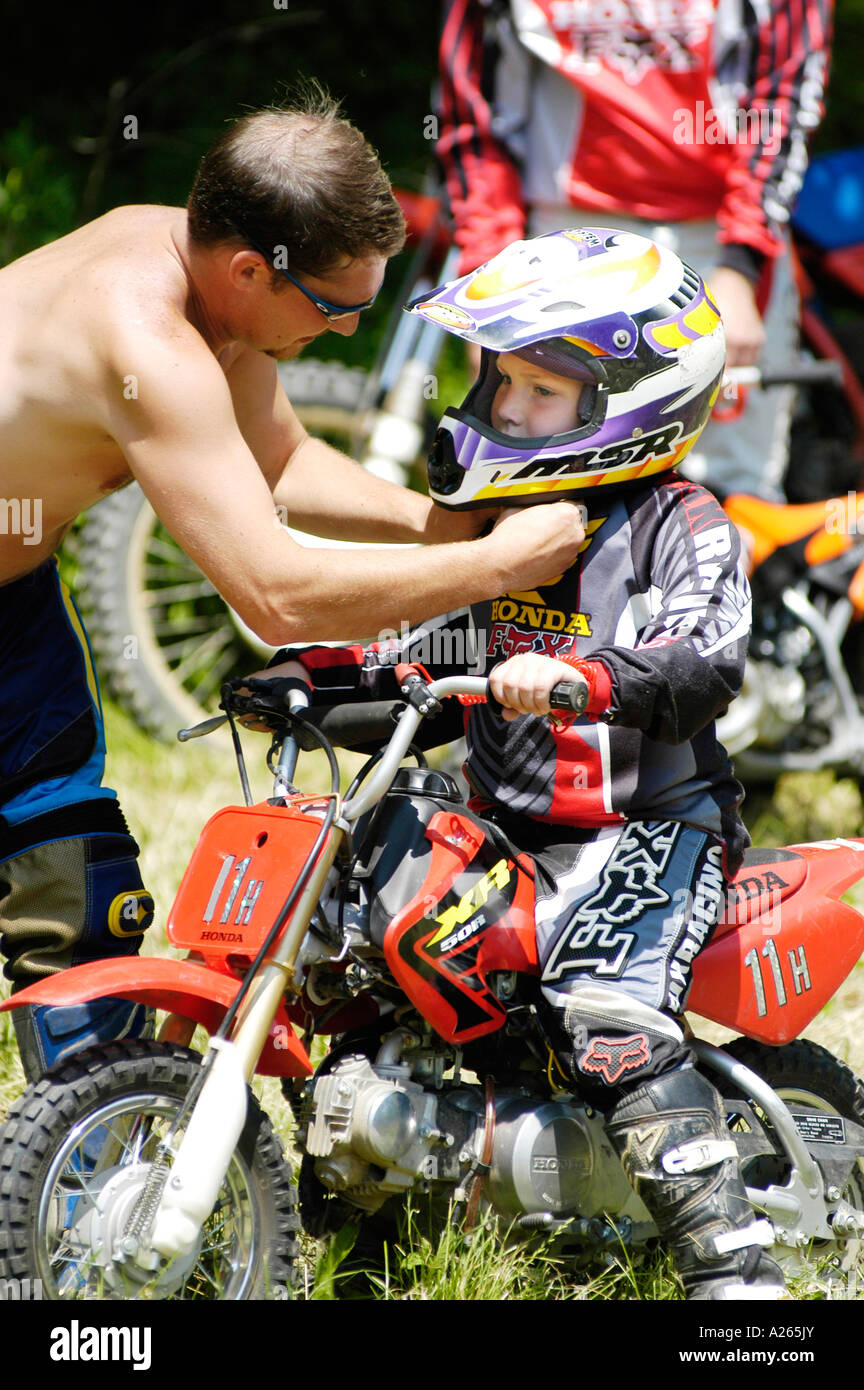 Contestants of all ages compete in a motorcycle hill climb race Stock ...