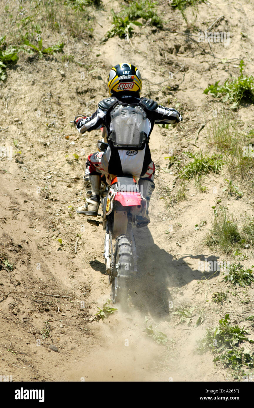 Contestants of all ages compete in a motorcycle hill climb race Stock ...