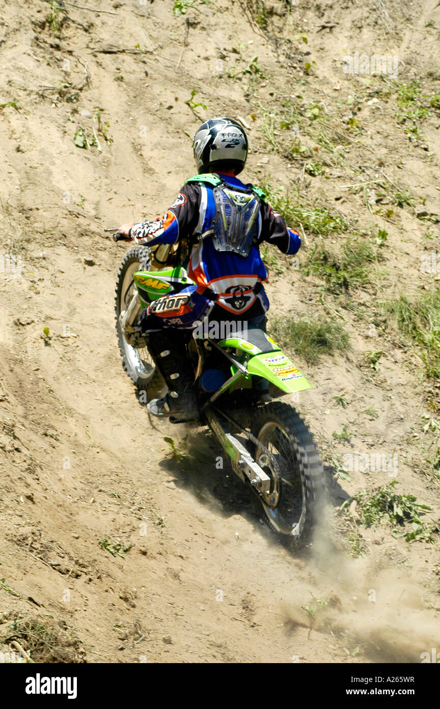 Contestants of all ages compete in a motorcycle hill climb race Stock ...