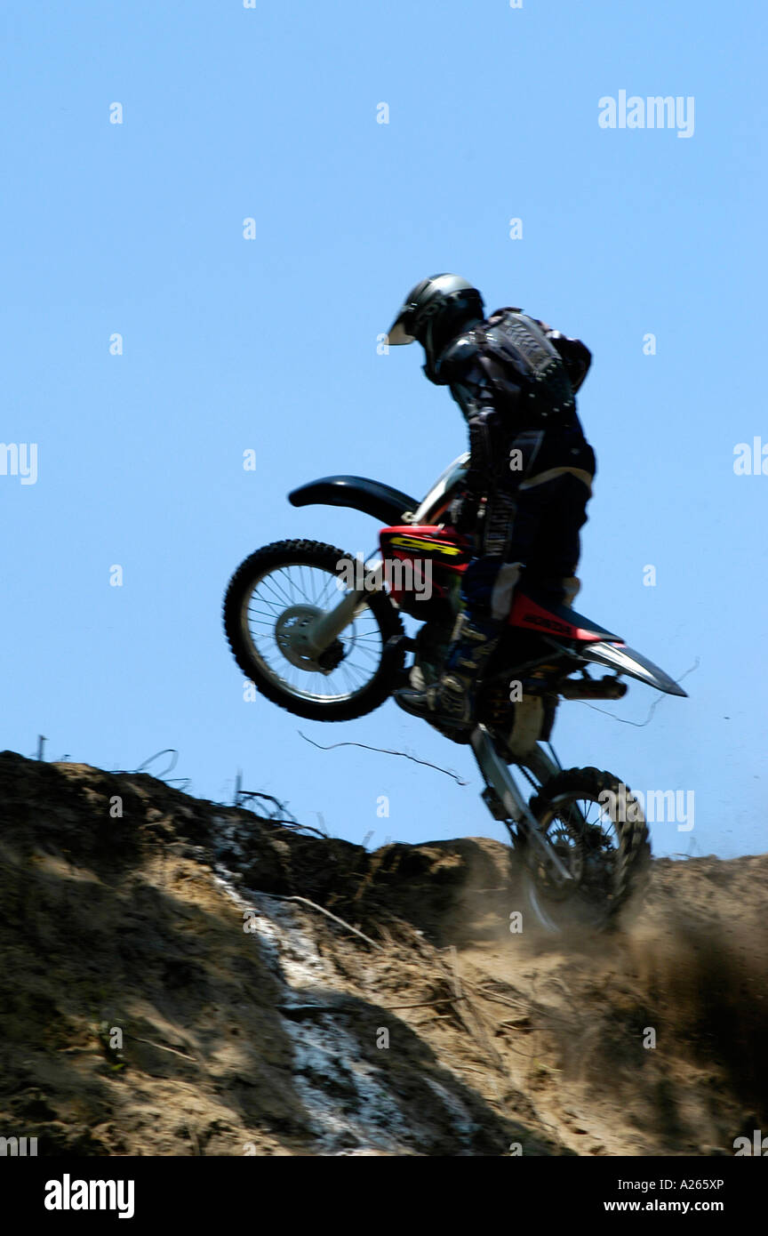 Contestants of all ages compete in a motorcycle hill climb race Stock ...