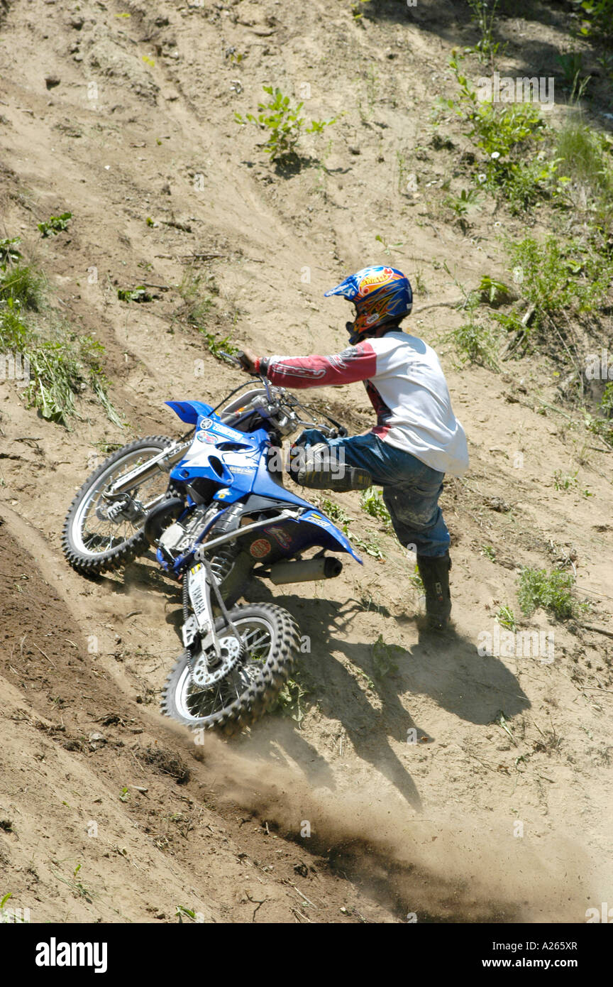 Contestants of all ages compete in a motorcycle hill climb race Stock ...