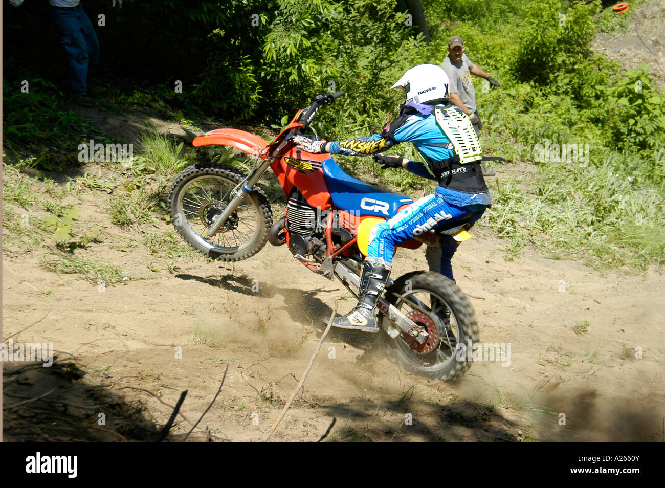 Contestants of all ages compete in a motorcycle hill climb race Stock ...