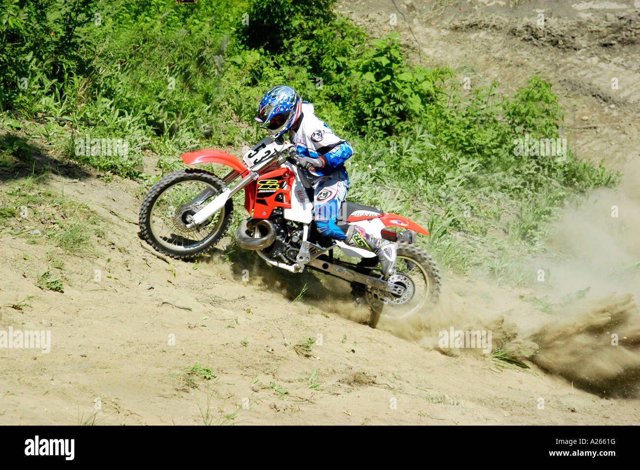 Contestants of all ages compete in a motorcycle hill climb race Stock ...