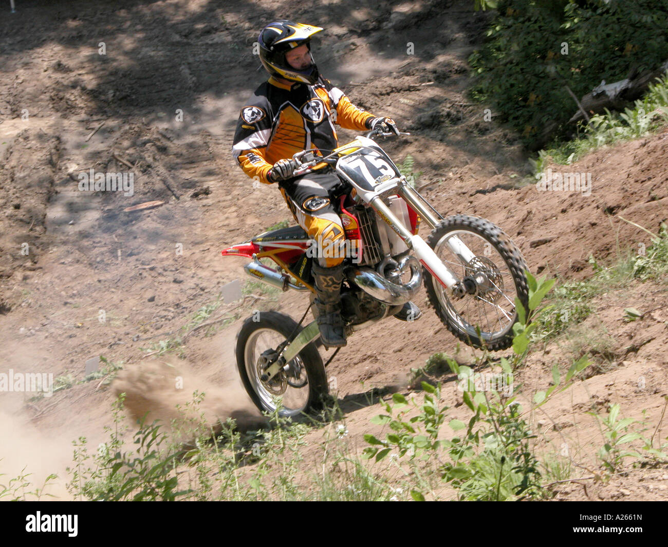 Contestants of all ages compete in a motorcycle hill climb race Stock ...