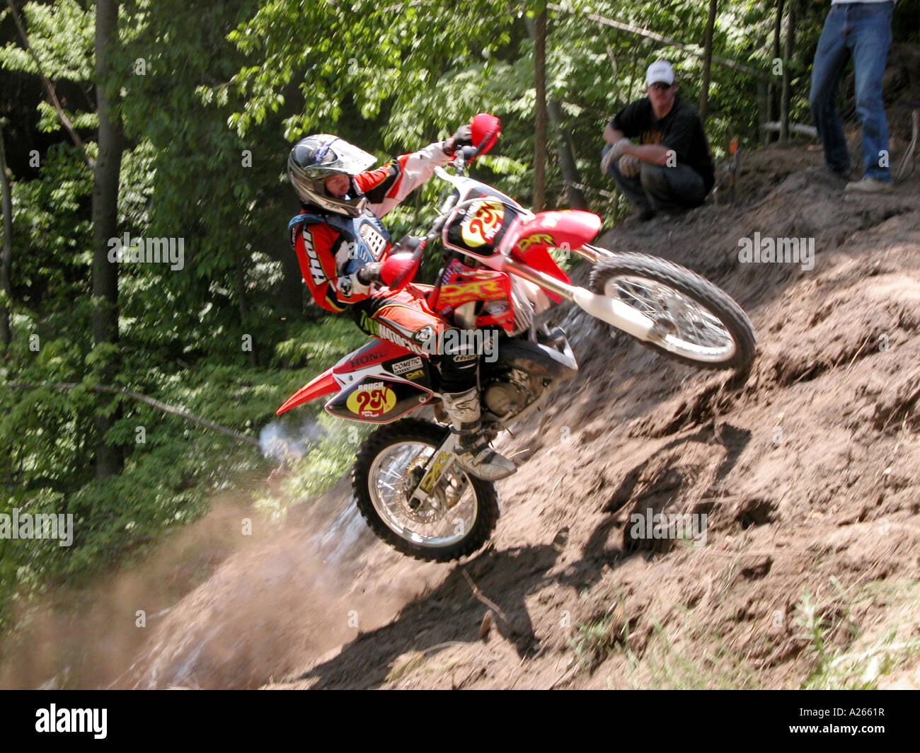 Contestants of all ages compete in a motorcycle hill climb race Stock ...