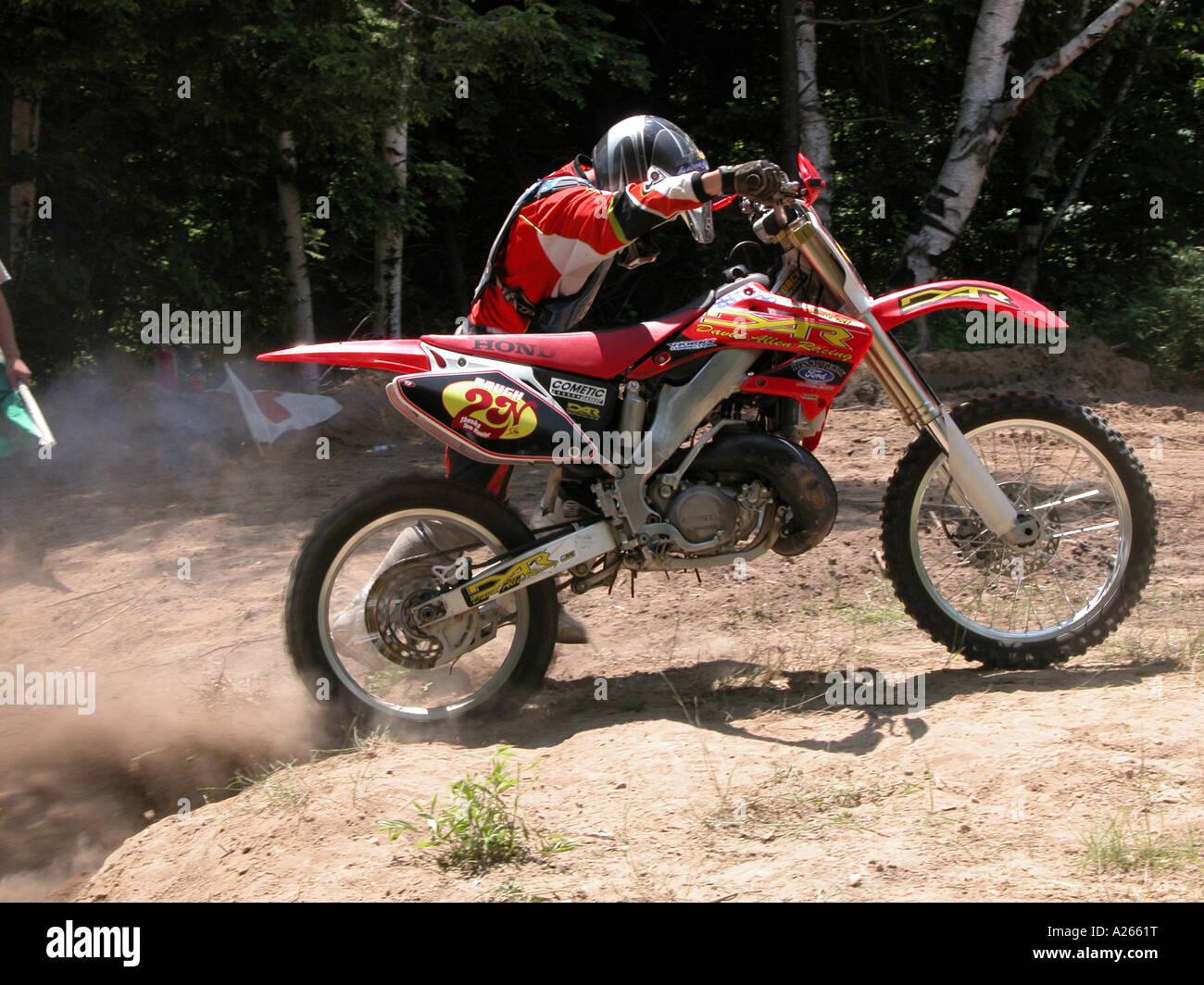 Contestants of all ages compete in a motorcycle hill climb race Stock ...