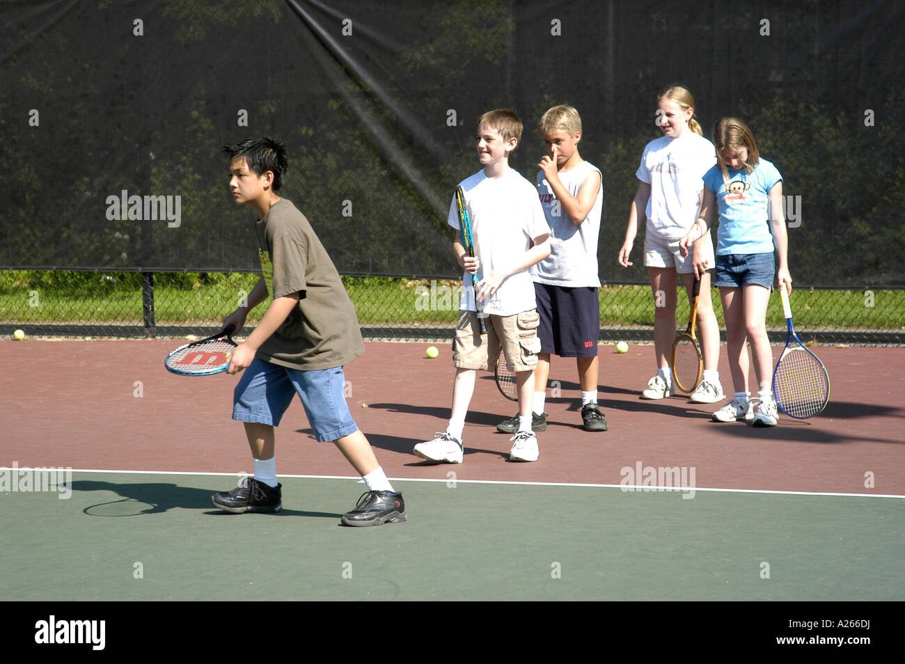 Tennis lessons are provided by a local municipality to help children ...