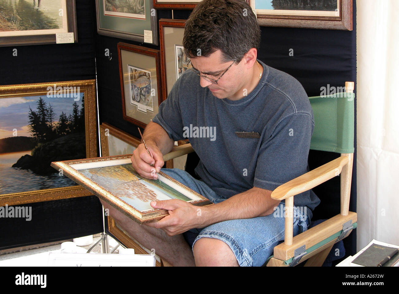 Adult male painting a picture Stock Photo - Alamy